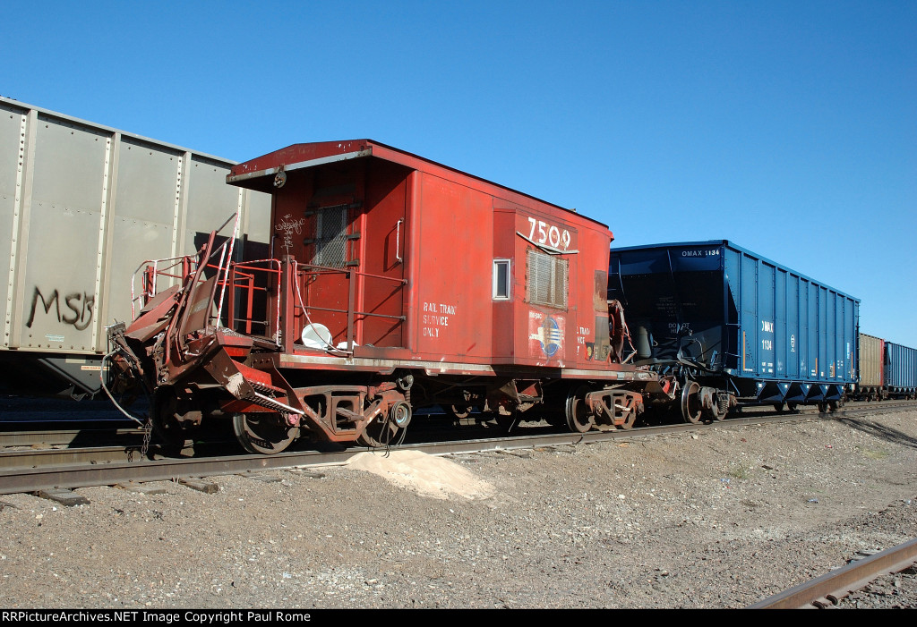 MP 7509, ex MoPac caboose damaged in a runaway collision of UP 9366 and between OMAX 1134 hopper